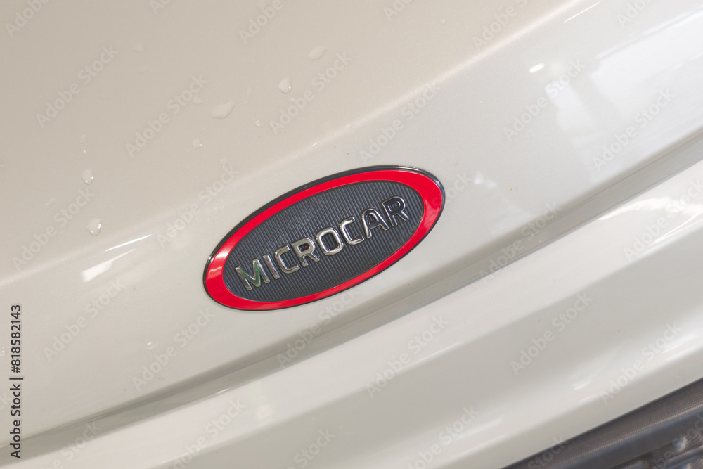 microcar brand text on small car logo sign automobiles mini vehicle ...