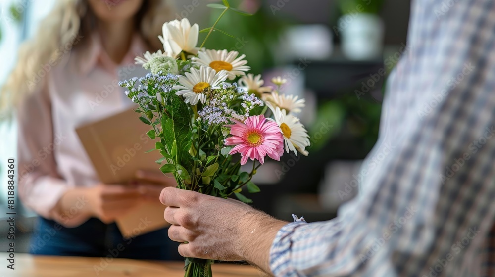 Professional receiving flowers and a card at their desk, celebrating a ...