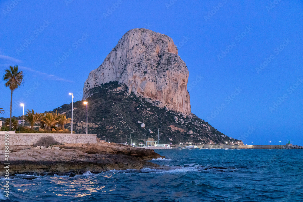 Sunset in Cala del Morelló next to the Torre del Molí, with views of ...