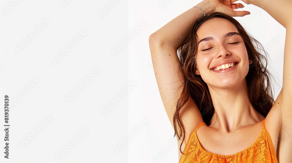 A beautiful woman smiling and holding her arms up, showing off the ...