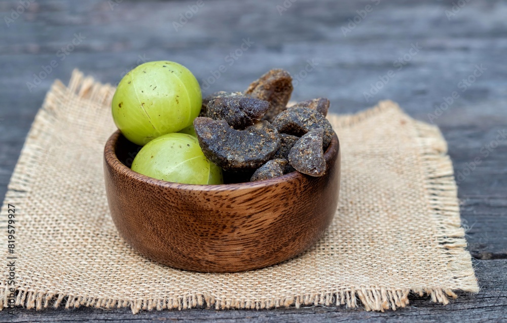 Indian Gooseberry Fruit or Amla Candy in a Wooden Bowl on Burlap Fabric ...