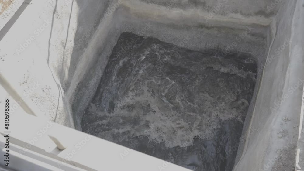 Water bubbling in sewage effluent of treatment plant. Process of water ...