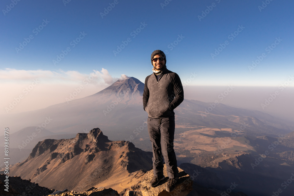 Hiker on summit with Iztaccihuatl volcano backdrop Stock Photo | Adobe ...