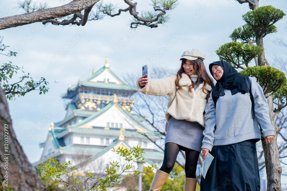 Travel, muslim travel, woman girl tourist Two Asian friends but ...