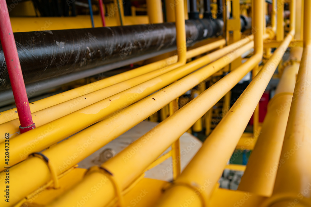 Male worker inspection at steel long pipes and pipe elbow in station ...