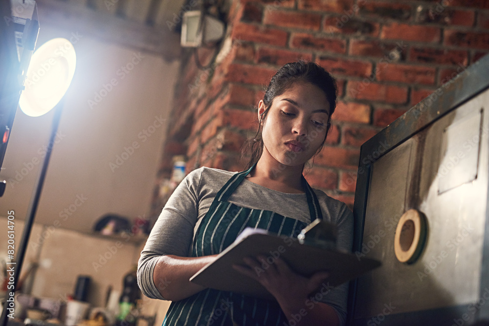 Workshop, woman and invoice checking with clipboard, paperwork and ...
