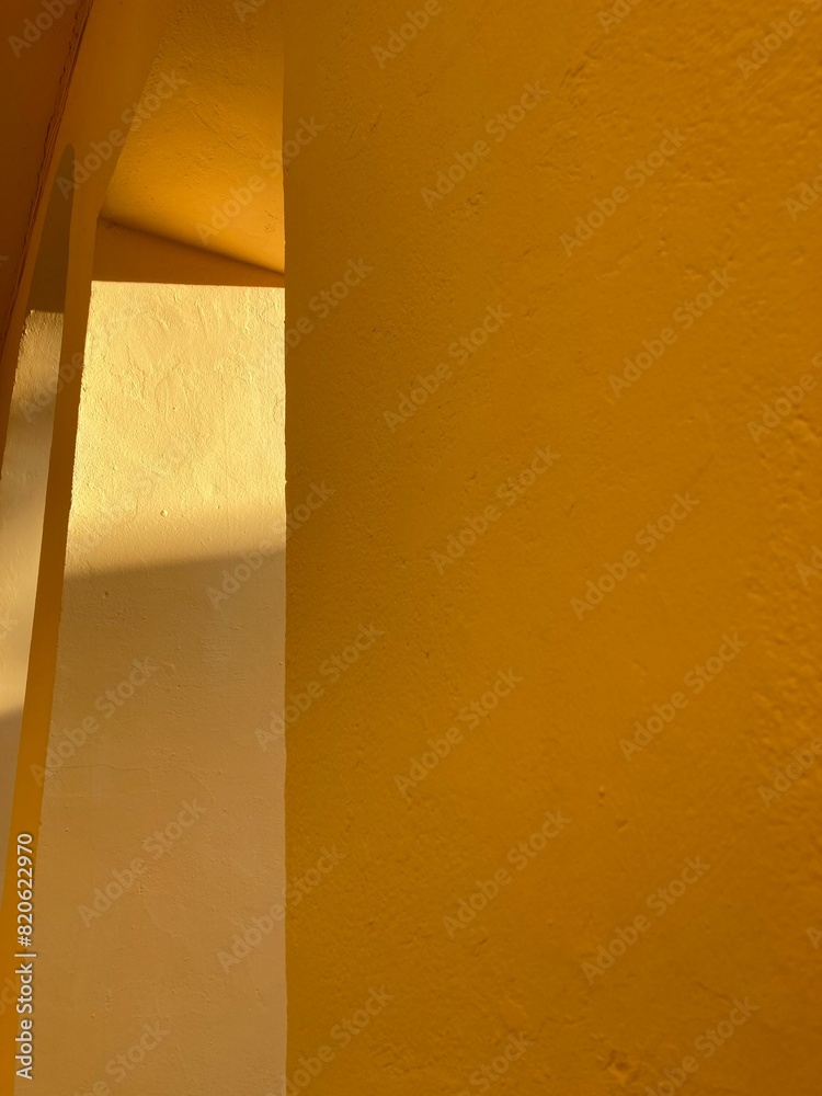 Abstract yellow geometric architectural forms. Modern buildings in the ...
