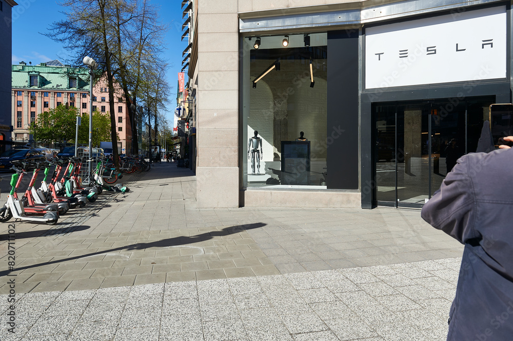 Stockholm, Sweden; Tesla car dealership with showcase showing humanoid ...