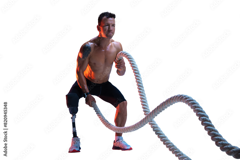 Muscular shirtless man, athlete with prosthetic leg training with ...
