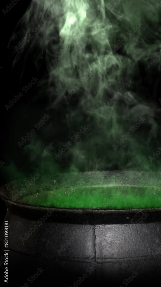 Vertical Witch Cauldron Smoking Green 4K Loop features a metal cauldron ...