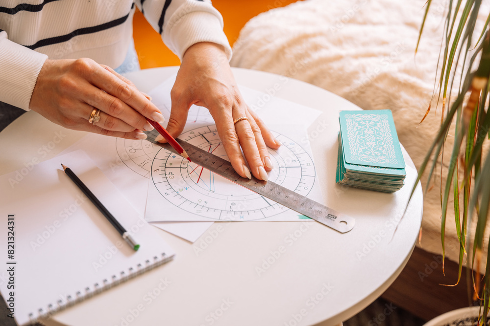Lady draws with a pencil and ruler on a natal chart. Stock Photo ...