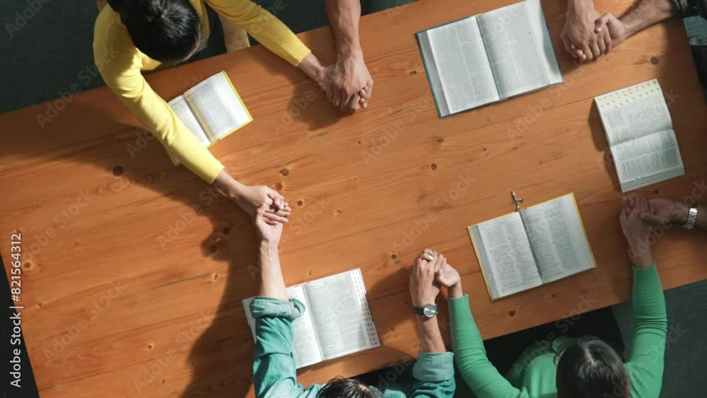 Top view of prayer hold each other support while prays to god at table ...