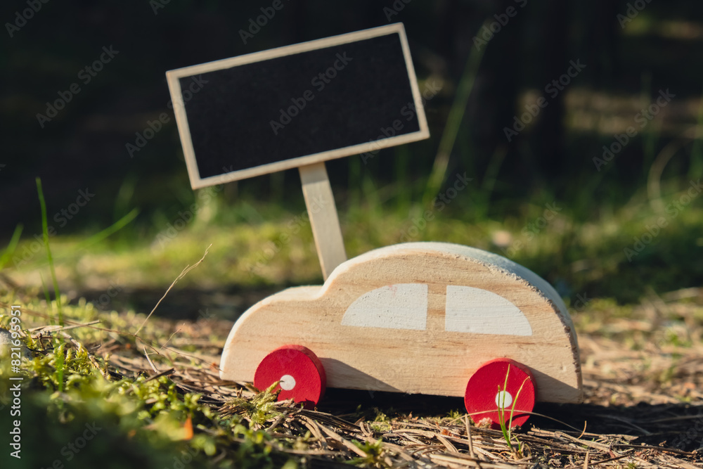 Empty blackboard with copy space Wooden toy car on greenery forest ...