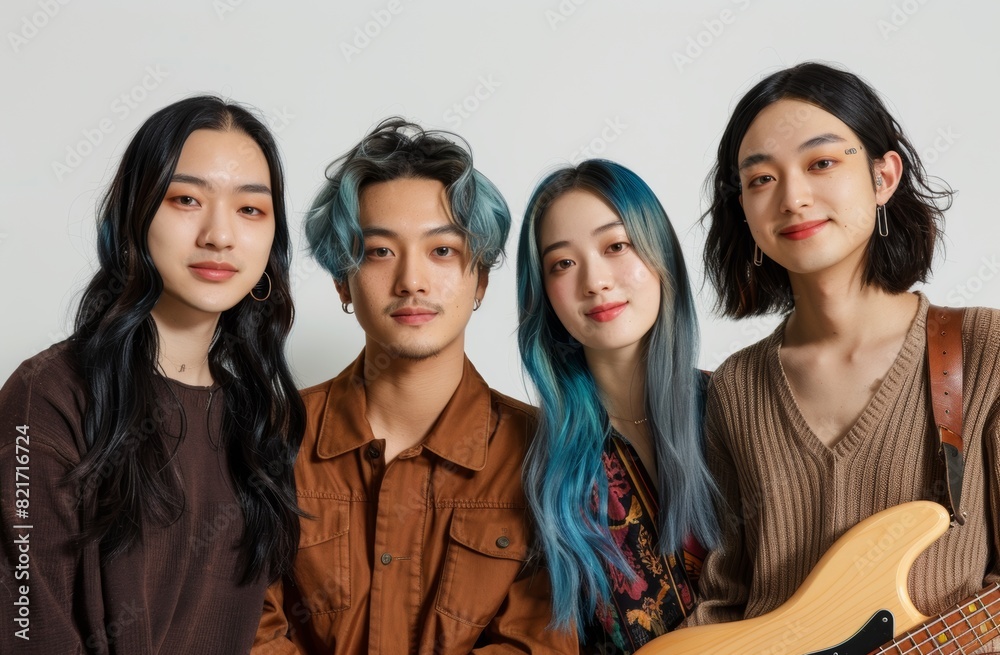 Group portrait of an asian band of four people, singer, guitarist ...