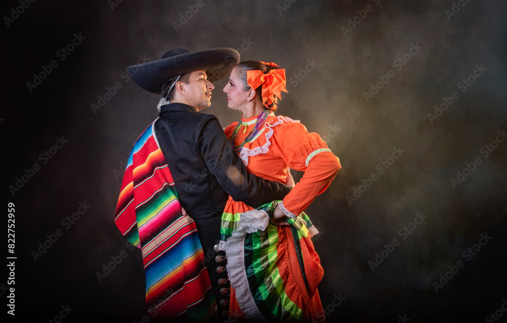Latin Mexican couple with Jalisco, charro costumes A man and woman in ...