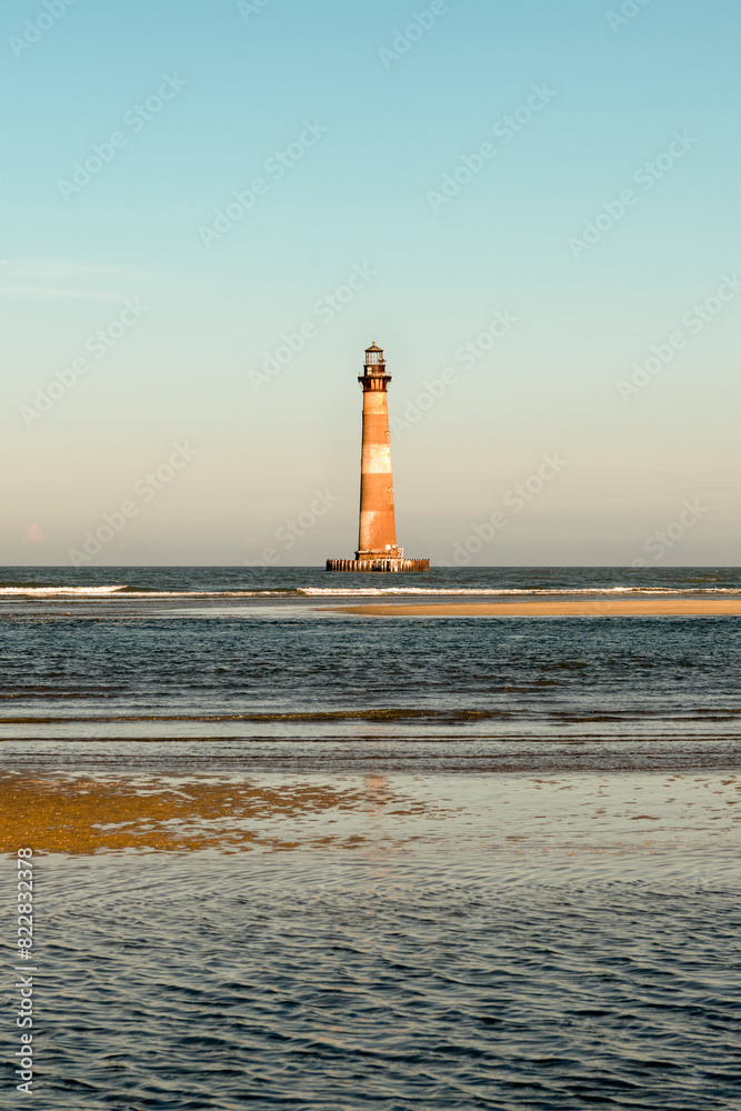 Morris Island Lighthouse from the shoreline of Folly Beach near ...