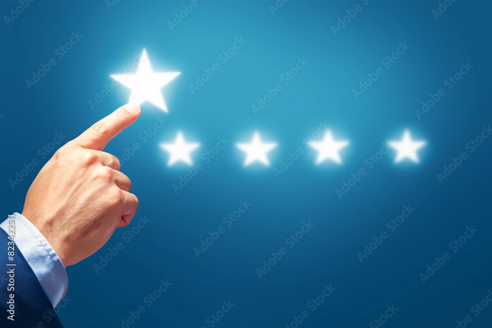 hand pointing at the first star in a five-star rating system on a blue ...