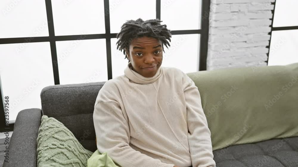 Fired up young african american woman, donning dreadlocks, seats in her ...