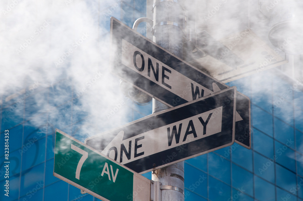 Traffic signs for one way street in the white haze Stock Photo | Adobe ...