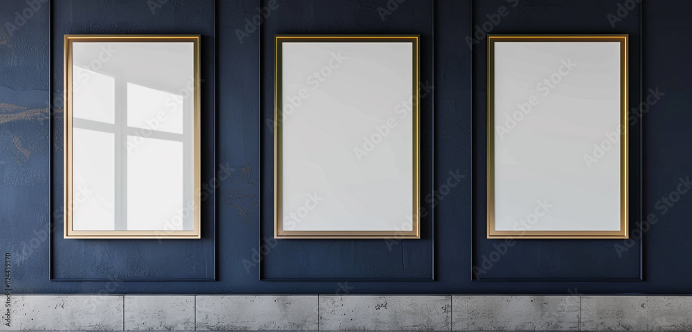 Three vertical frames mockup hanging on office wall, navy blue walls ...