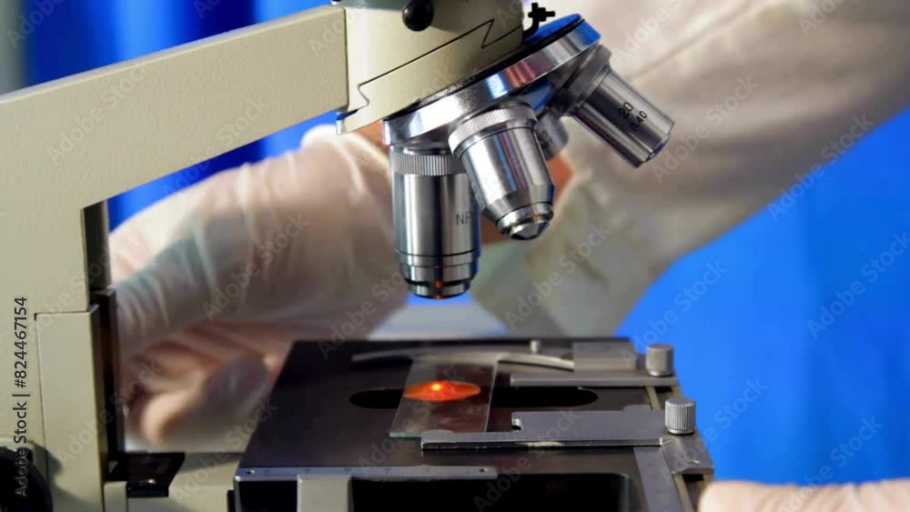 Close-up view of an automated scientific laboratory microscope ...