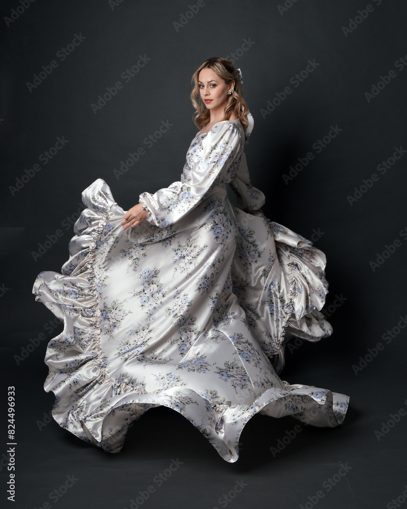 portrait of beautiful blonde female model wearing romantic historical ...