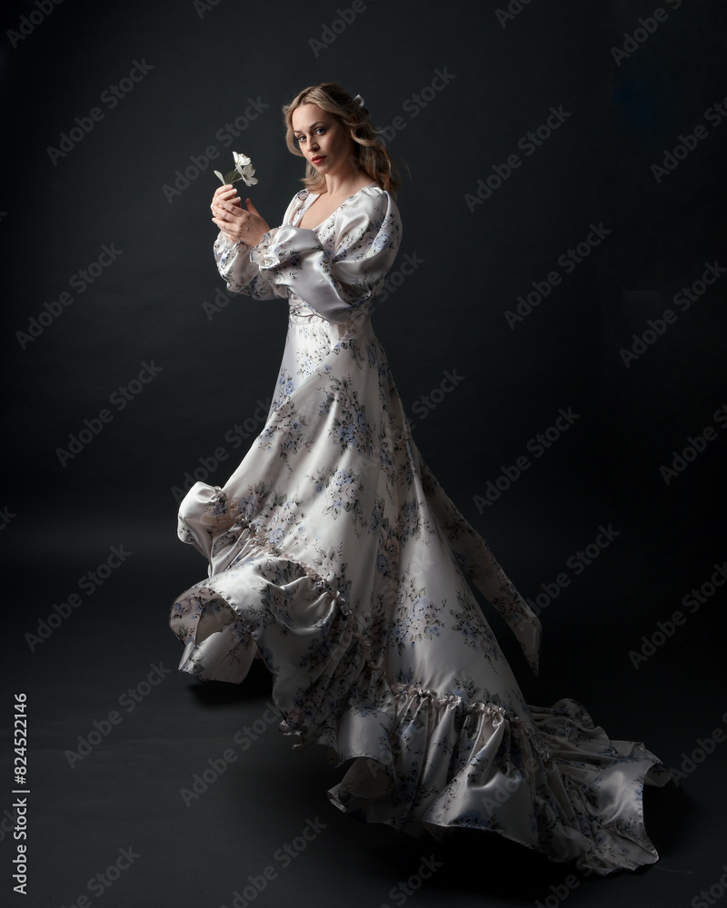 portrait of beautiful blonde female model wearing romantic historical ...