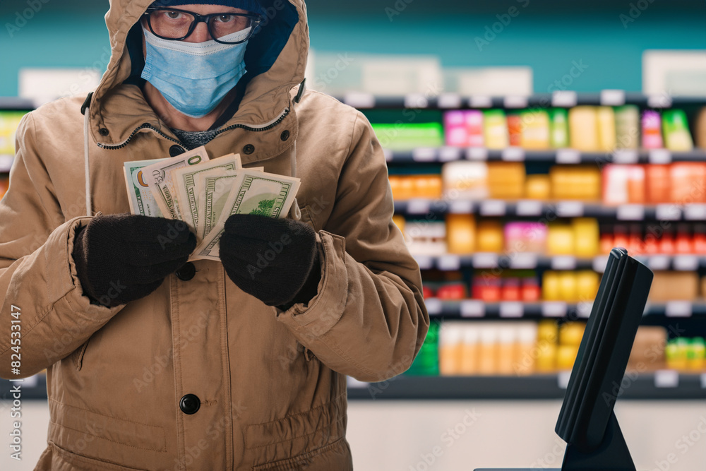 Portrait of young man in medical mask holding cash dollars money and ...