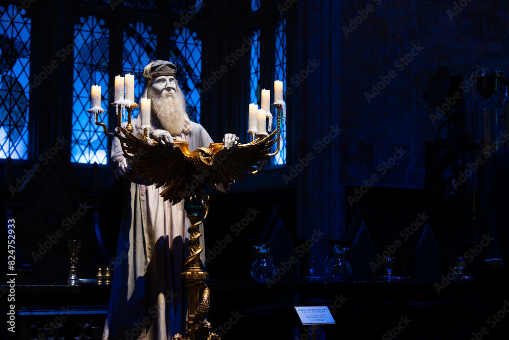 JAPAN - NOV 13, 2023: Dumbledore wizard statue illuminate candlelight ...