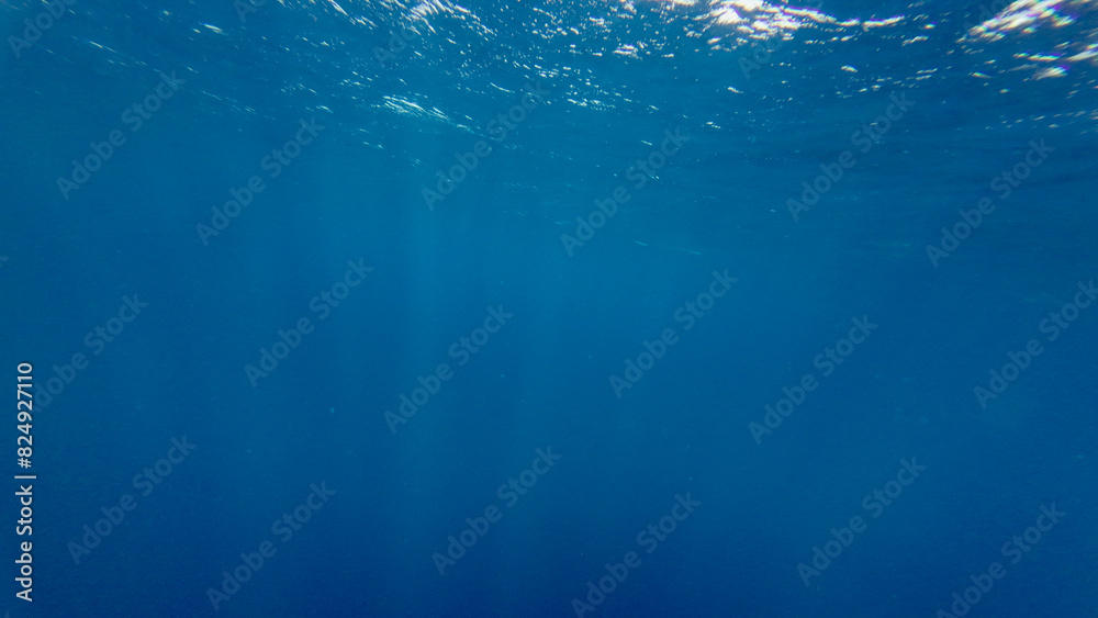 Underwater world background. Rays of the sun in the water column ...