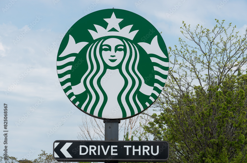 drive thru and round roadside signs of Starbucks, a coffee shop chain ...