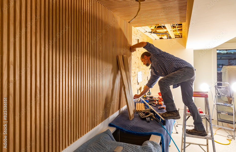 Blue Collar worker Carpenter building Vertical wood paneling wall Stock ...