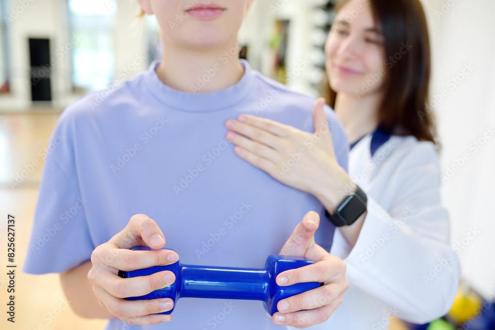The rehab doctor conducts the patient's appointment in the gym. The PMR ...