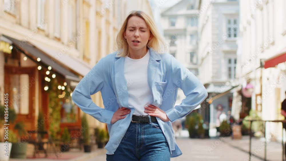 Caucasian young woman traveler feeling sudden strong abdominal stomach ...