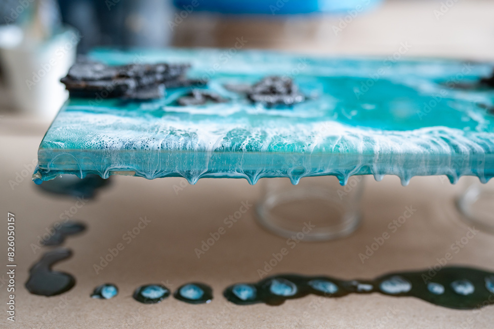 Finished painting dries after being poured with epoxy resin, liquid art ...