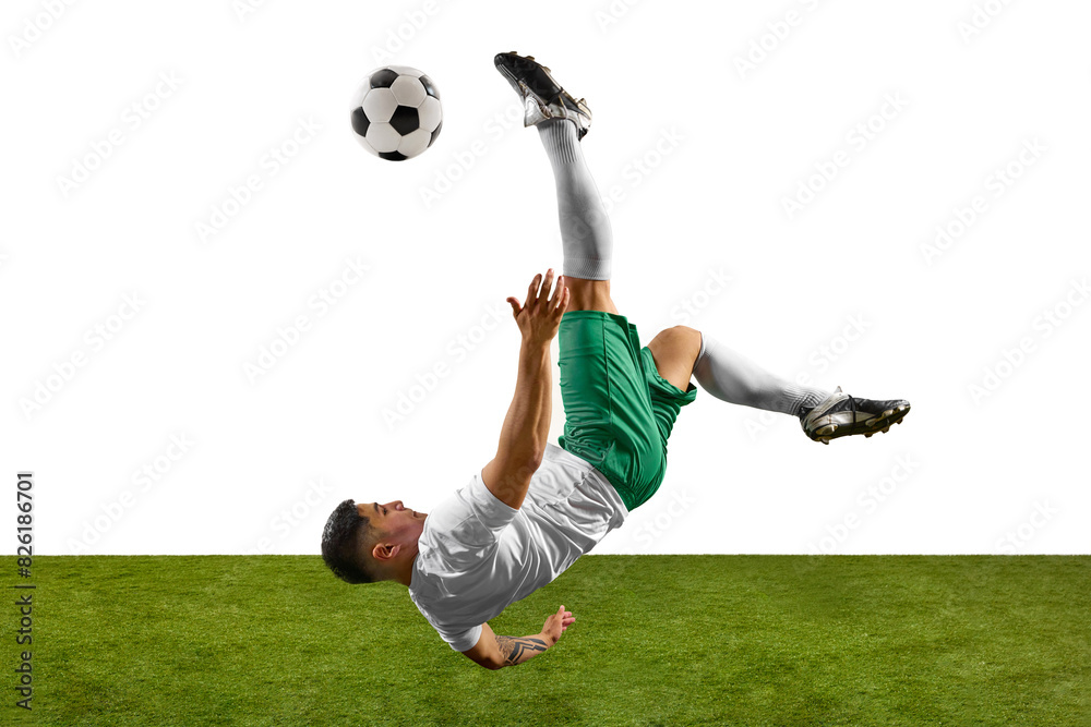 Footballer performing dramatic overhead kick, with his body upside down ...