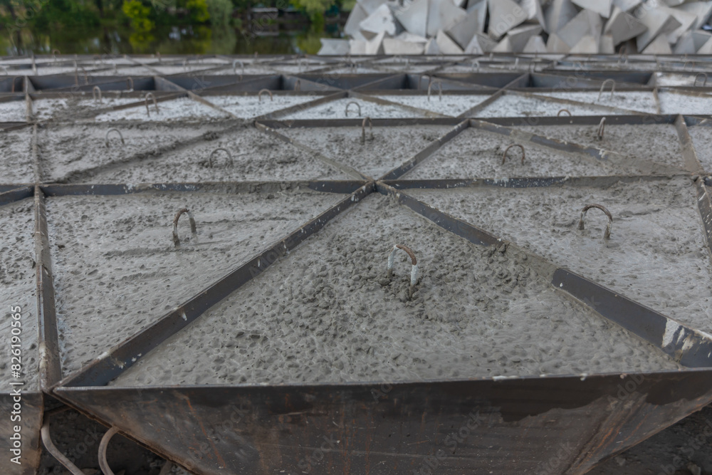 Making dragon teeth for defense. Concrete pyramids. Protection and trap ...