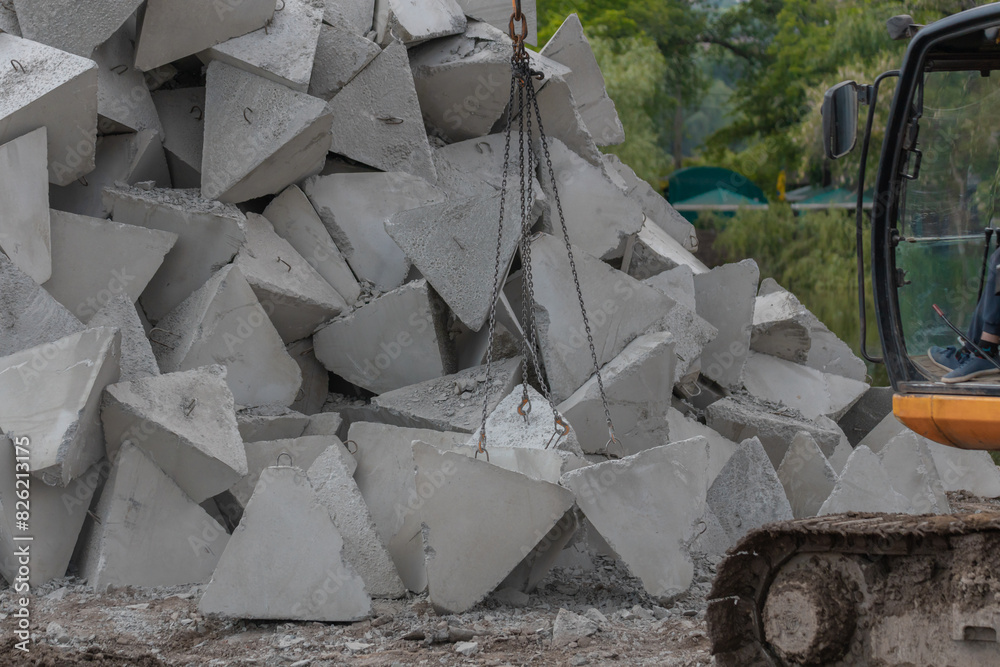 Loading and transporting dragon teeth for defense. Concrete pyramids ...