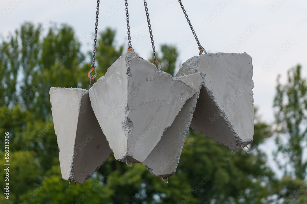 Loading and transporting dragon teeth for defense. Concrete pyramids ...