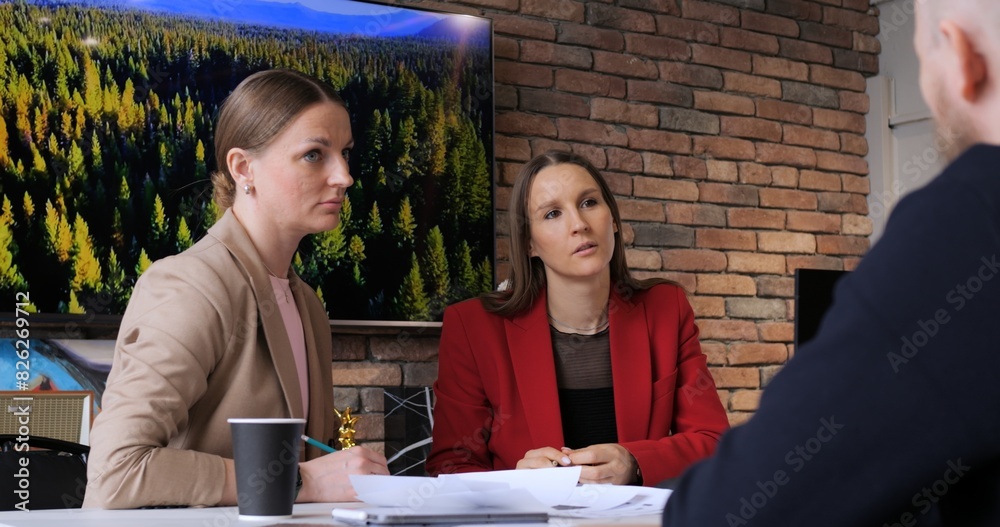 Marketing team discussing strategy in modern office. Diverse group ...