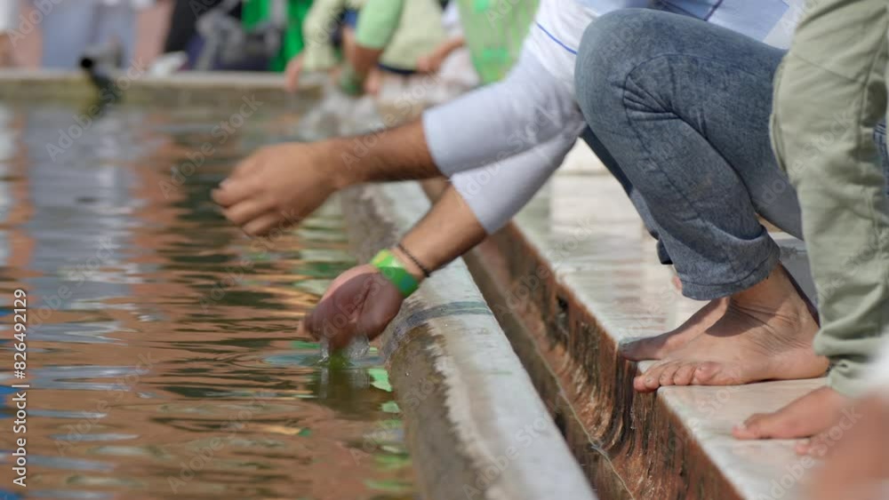 Close up shot of Indian Muslims washing their hands at the ablution ...