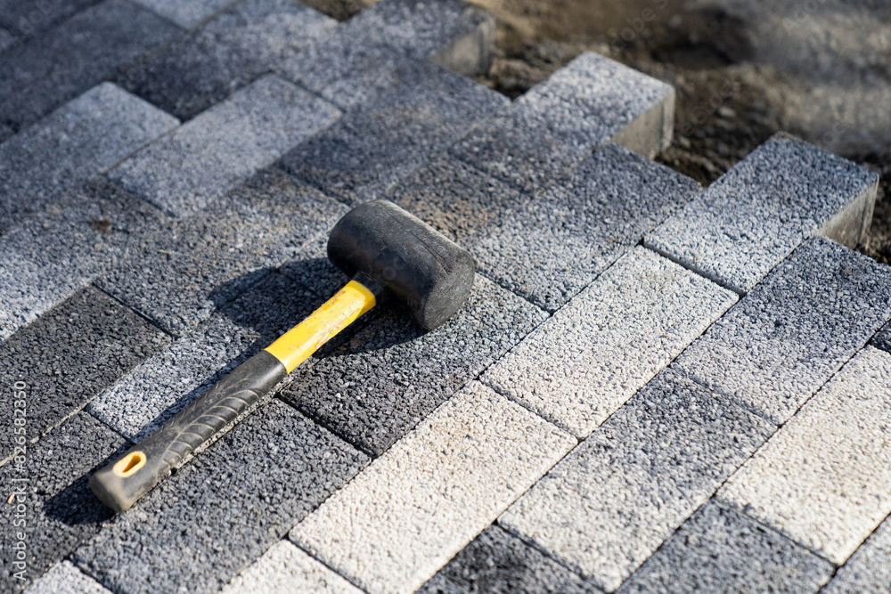 Garden brick pathway paving by professional paver worker. Repairing ...