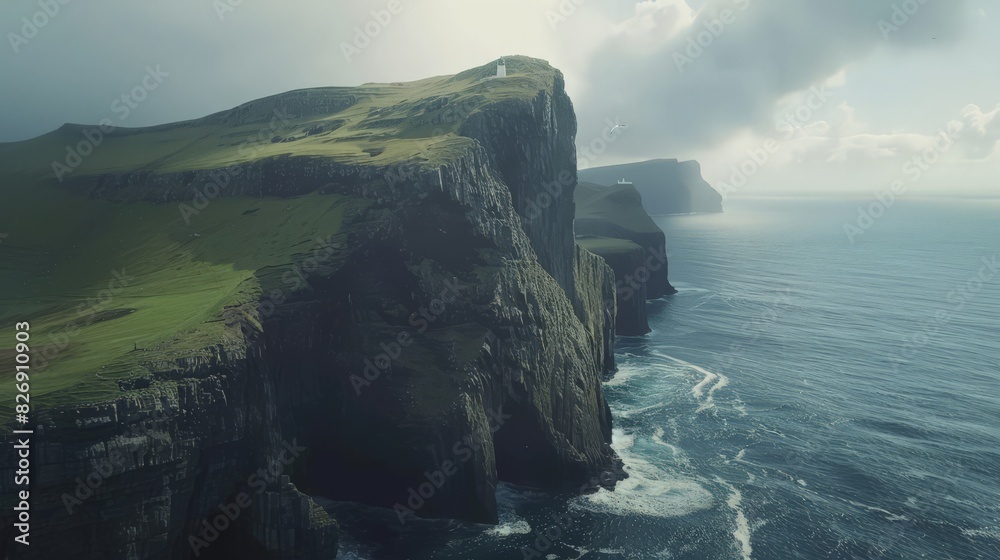 Atop Mykines Holmur, the lighthouse overlooks the dramatic cliffs and ...