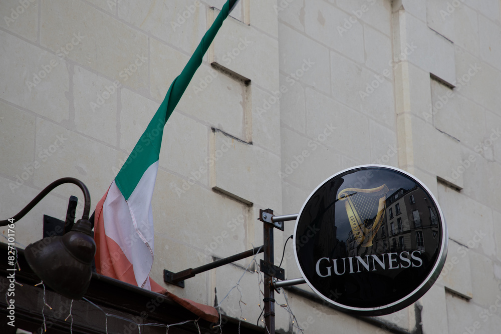 guinness beer sign brand and text logo round on wall building ...