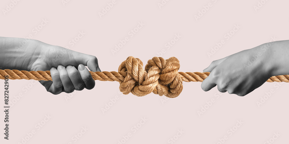 Two hands tie a knot in a rope. Tug of war. Two hands pull on a rope ...