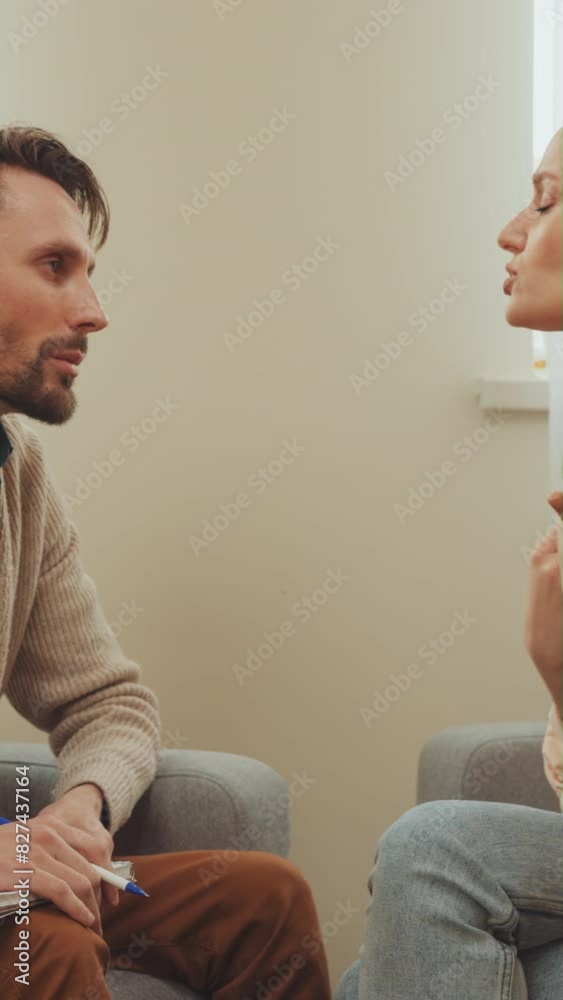 Vertical Screen: Distressed woman in emotional therapy session with ...