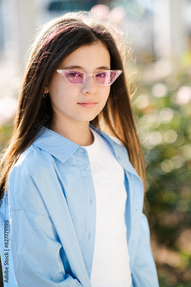 Stylish teenage girl 10 - 12 year old wearing sun glasses and blue ...