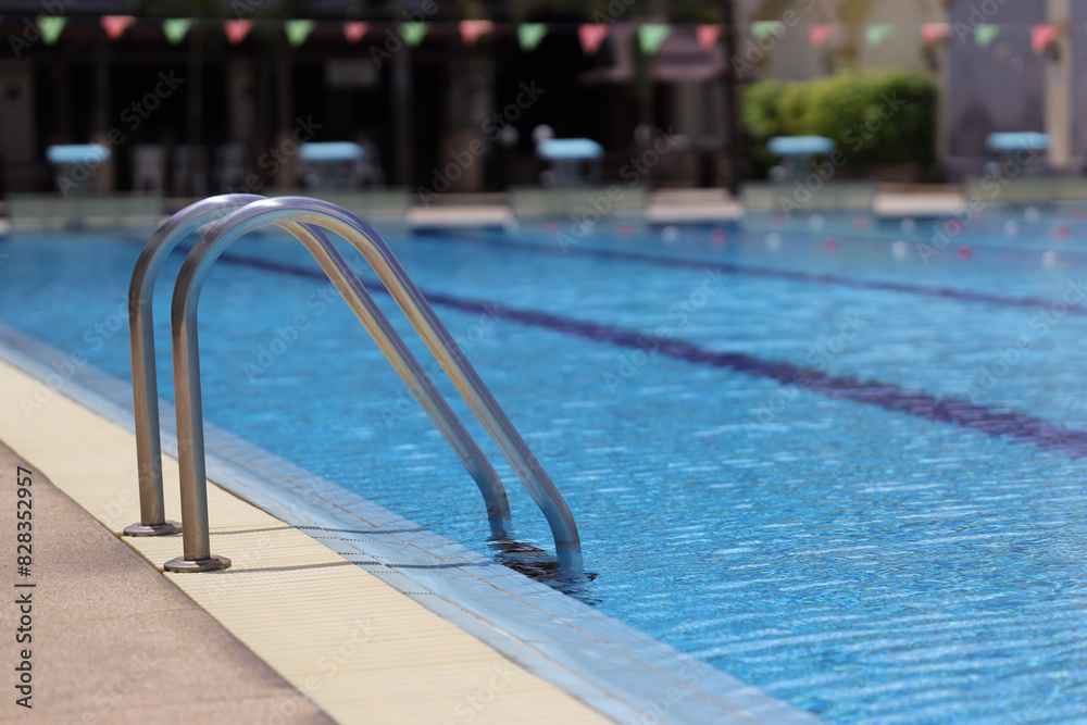 Ladder stainless handrails for descent into swimming pool. Swimming ...