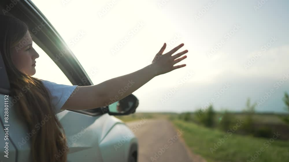 passenger enjoys breeze while driving hand outstretched travel spirit ...