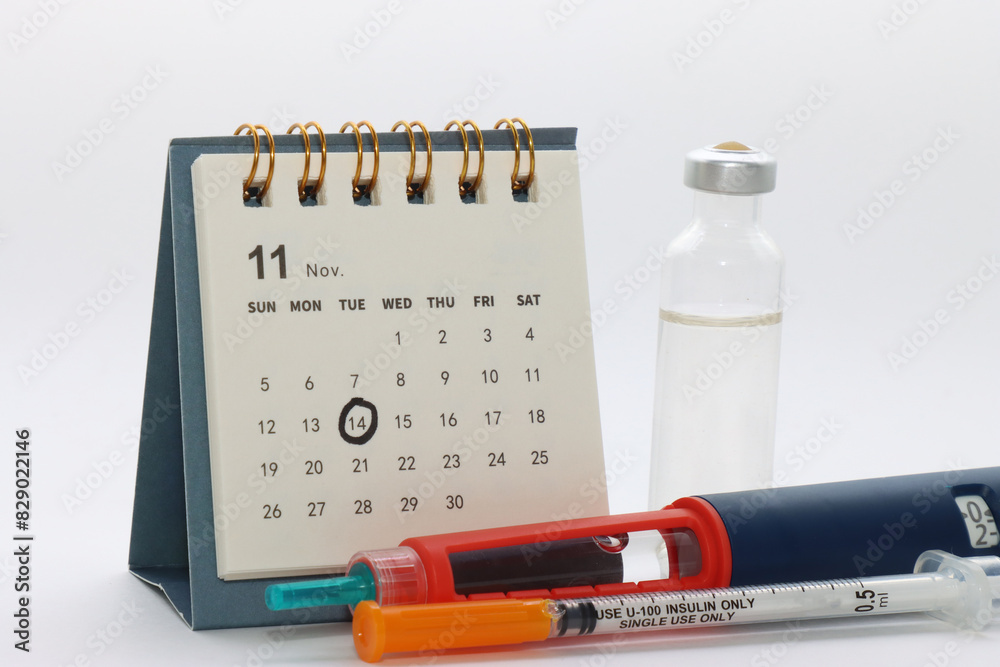 Calendar with world diabetes day marked and a insulin vial, insulin pen ...